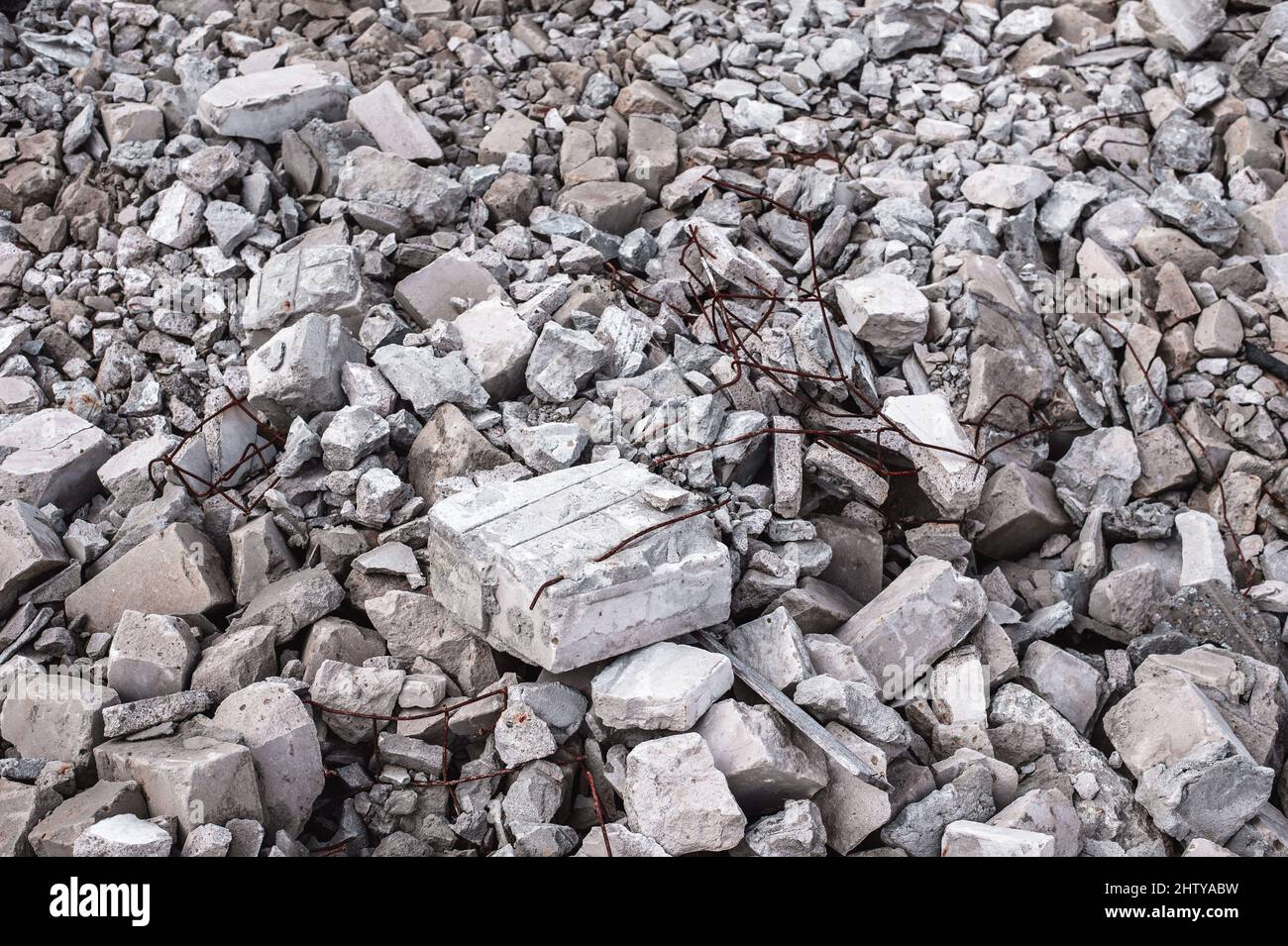 A pile of construction debris in close-up of a concrete block with ...