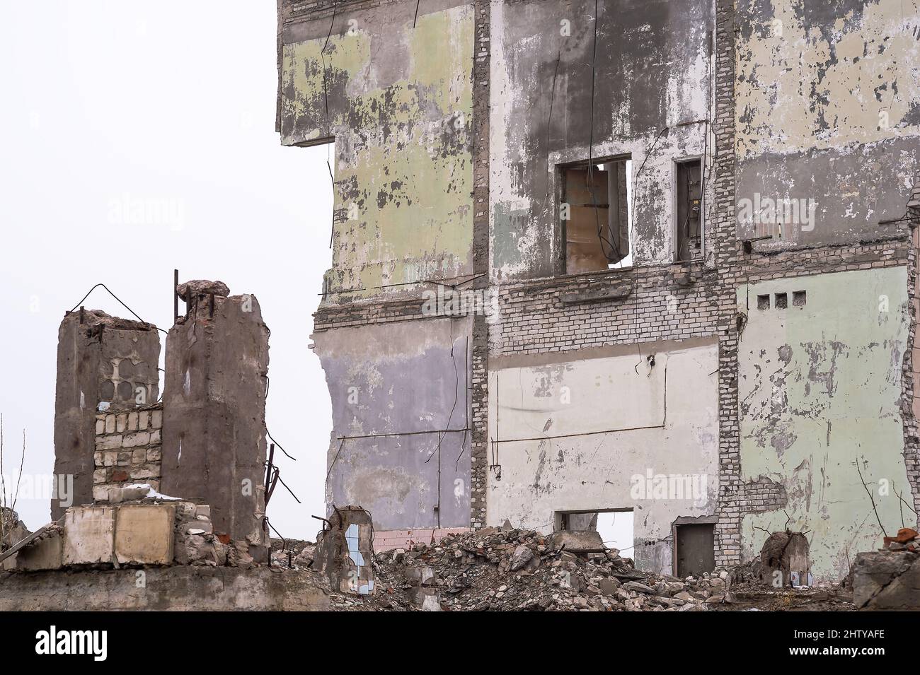 Concrete fragments of the destroyed foundation against the background ...