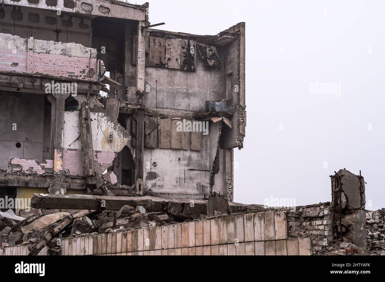 Concrete fragments of the destroyed foundation against the background ...
