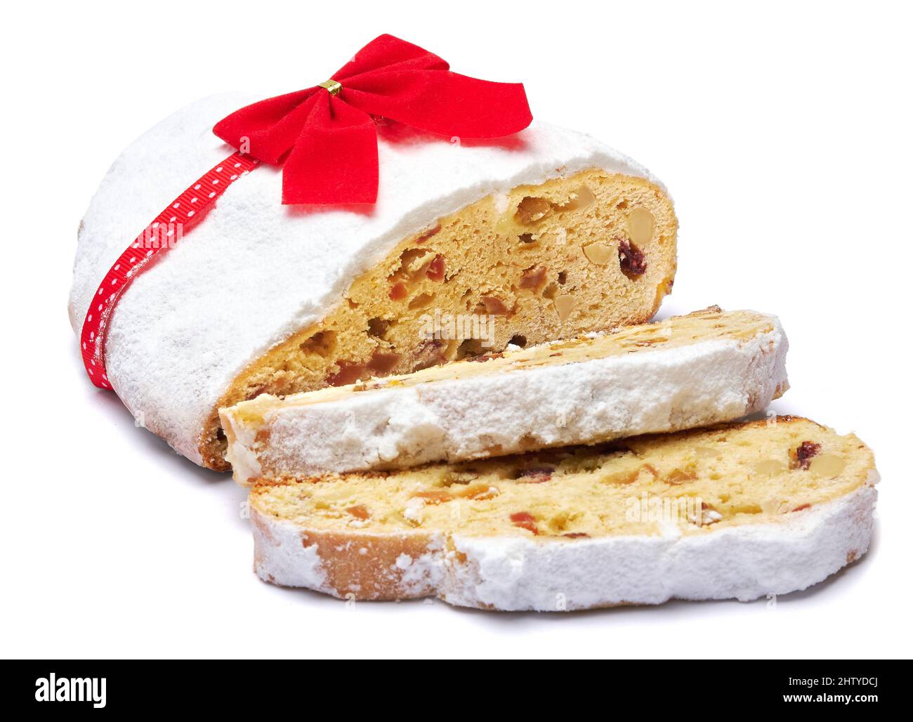 Sliced Traditional Christmas stollen cake with marzipan and dried fruit ...