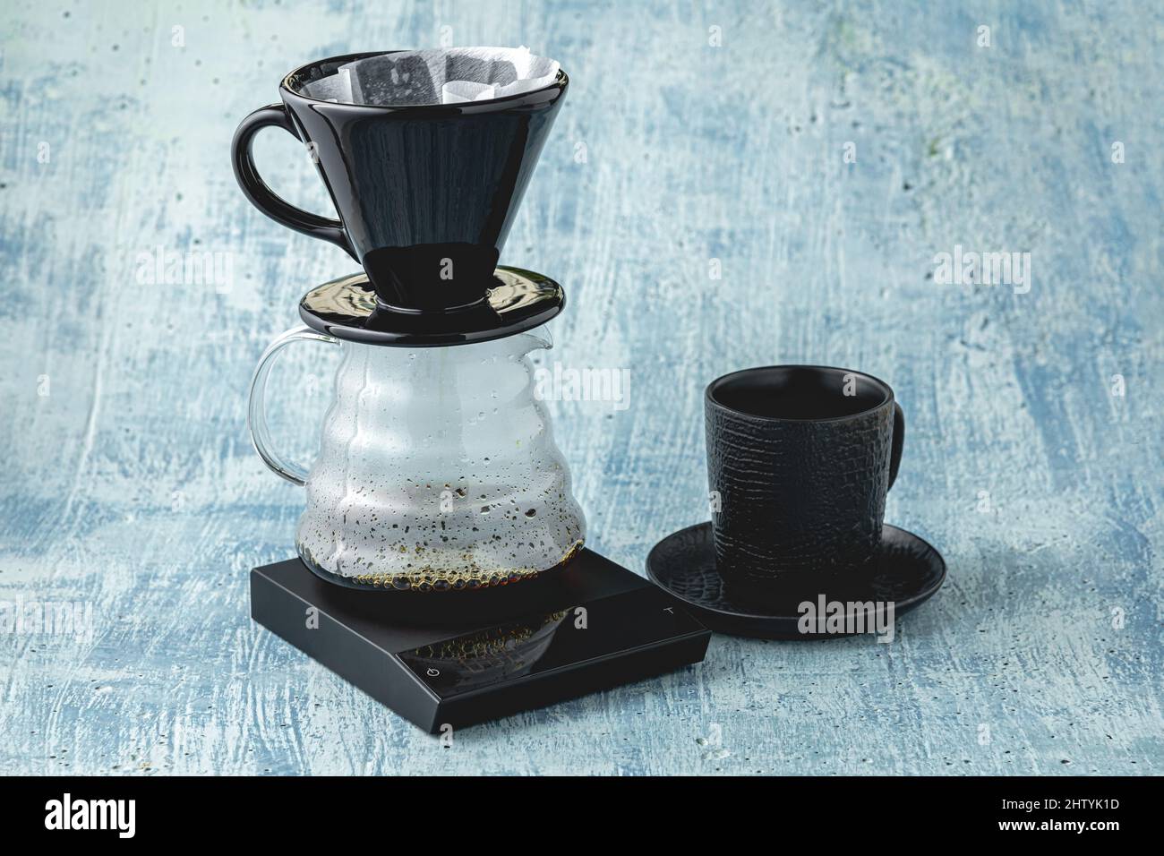 Professional barista brews coffee with pour over method. Alternative ...