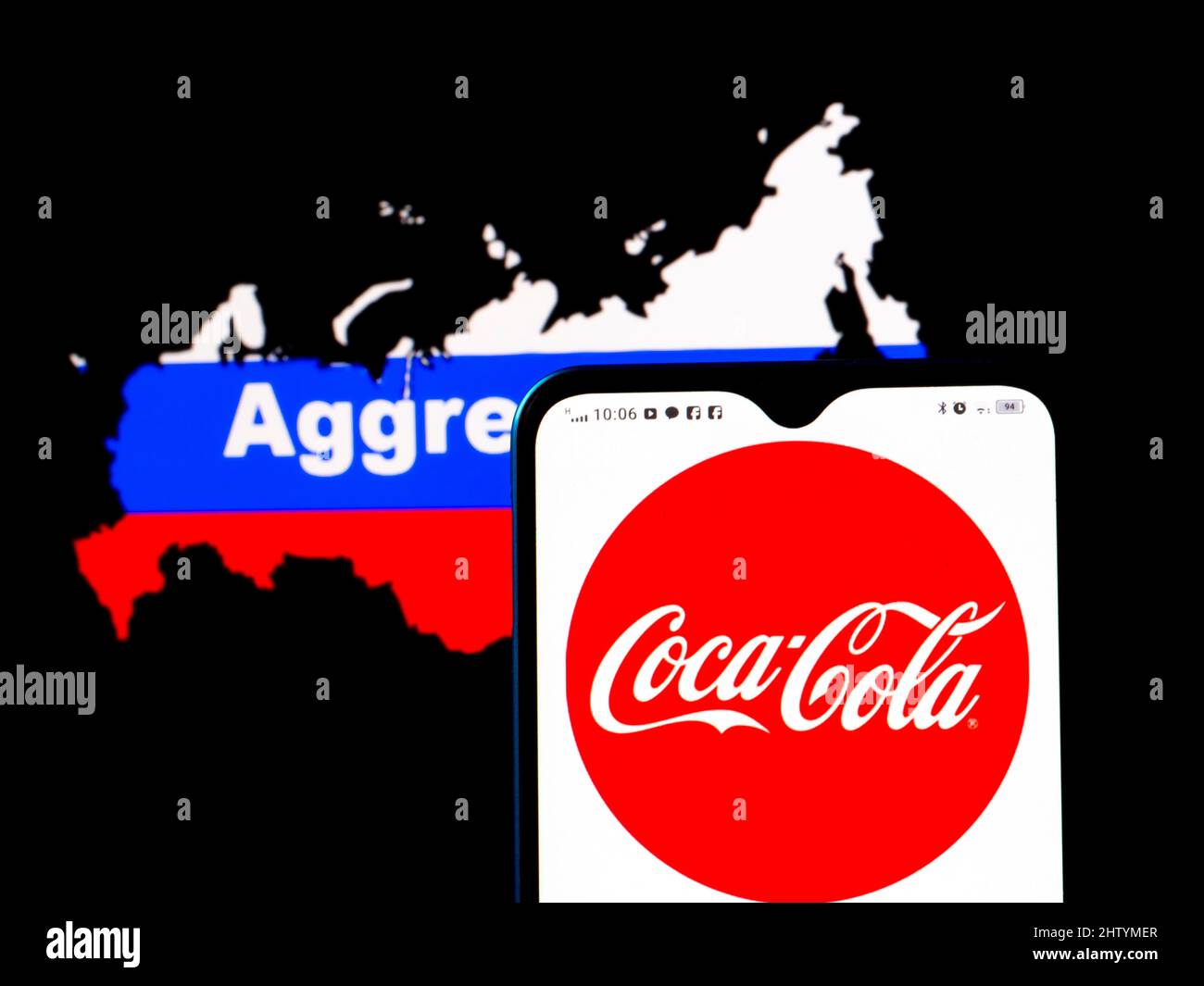 In this photo illustration, the Coca Cola logo is displayed on a ...
