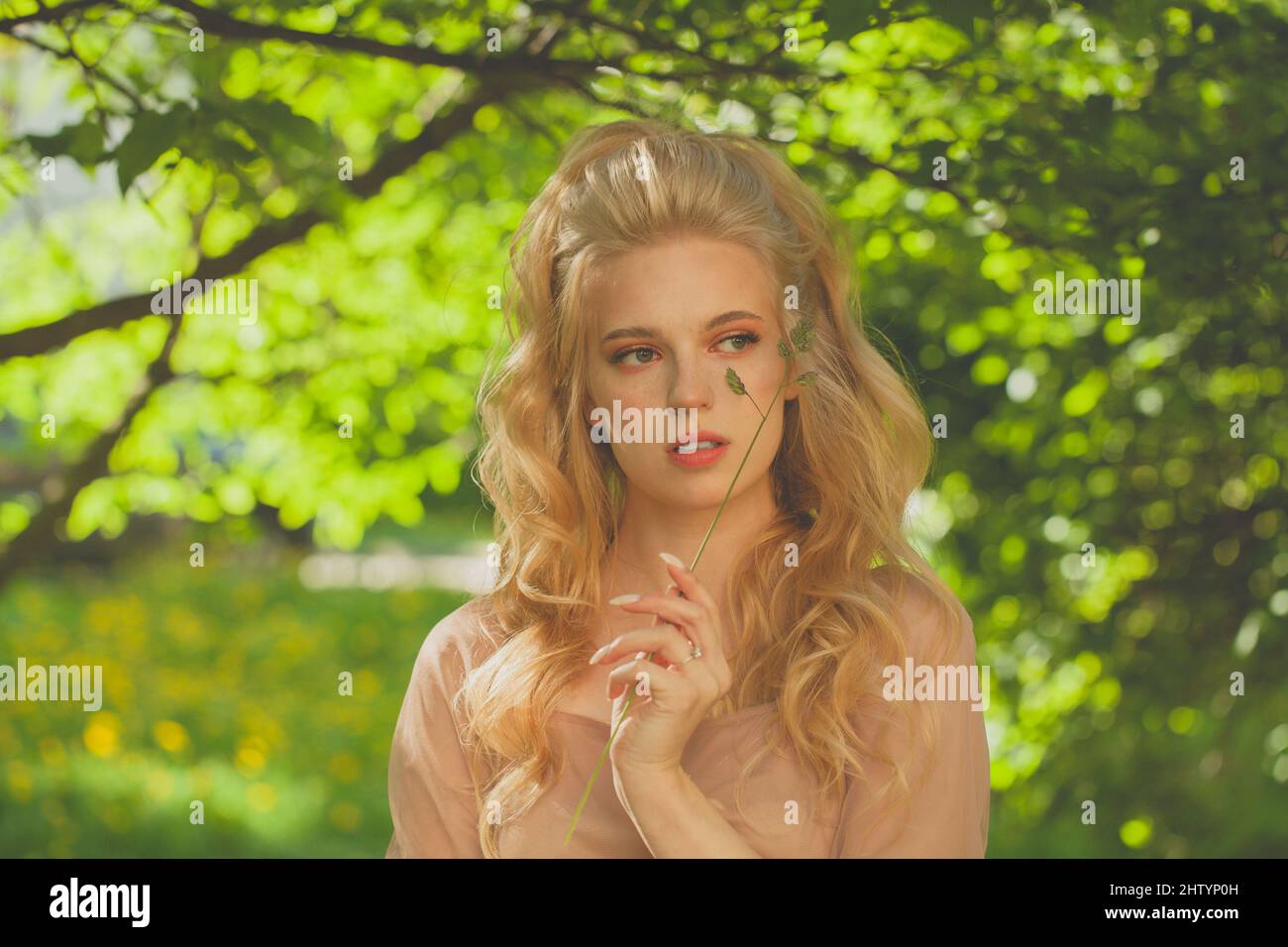 Beautiful fashion model woman enjoying nature, breathing fresh air in ...