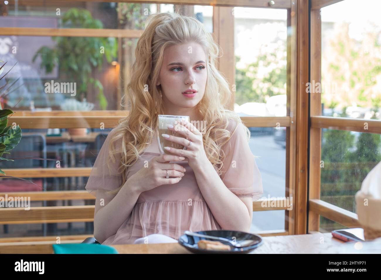 Beautiful female model woman drinking coffee in a italian cafe Stock ...