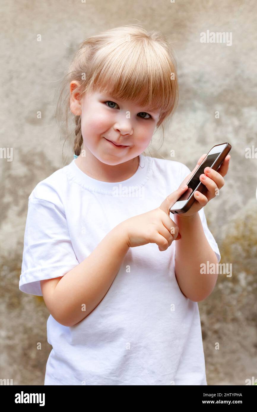 One single young elementary school age girl, child pointing at her ...