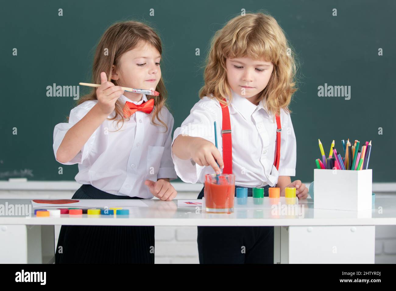 Little artists painting, kids drawing art. Portrait school kids doing ...