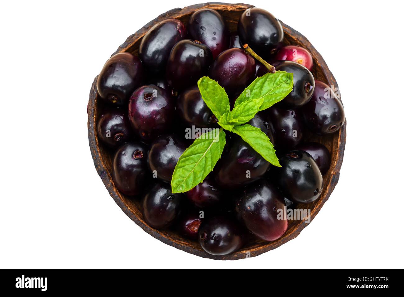 Dark pink-red ripe Syzygium cumini fruits. Dark black java plum in a ...