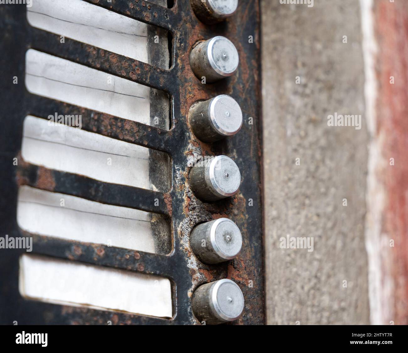 Old rusty flat apartment, abandoned building, house entry phone buttons ...