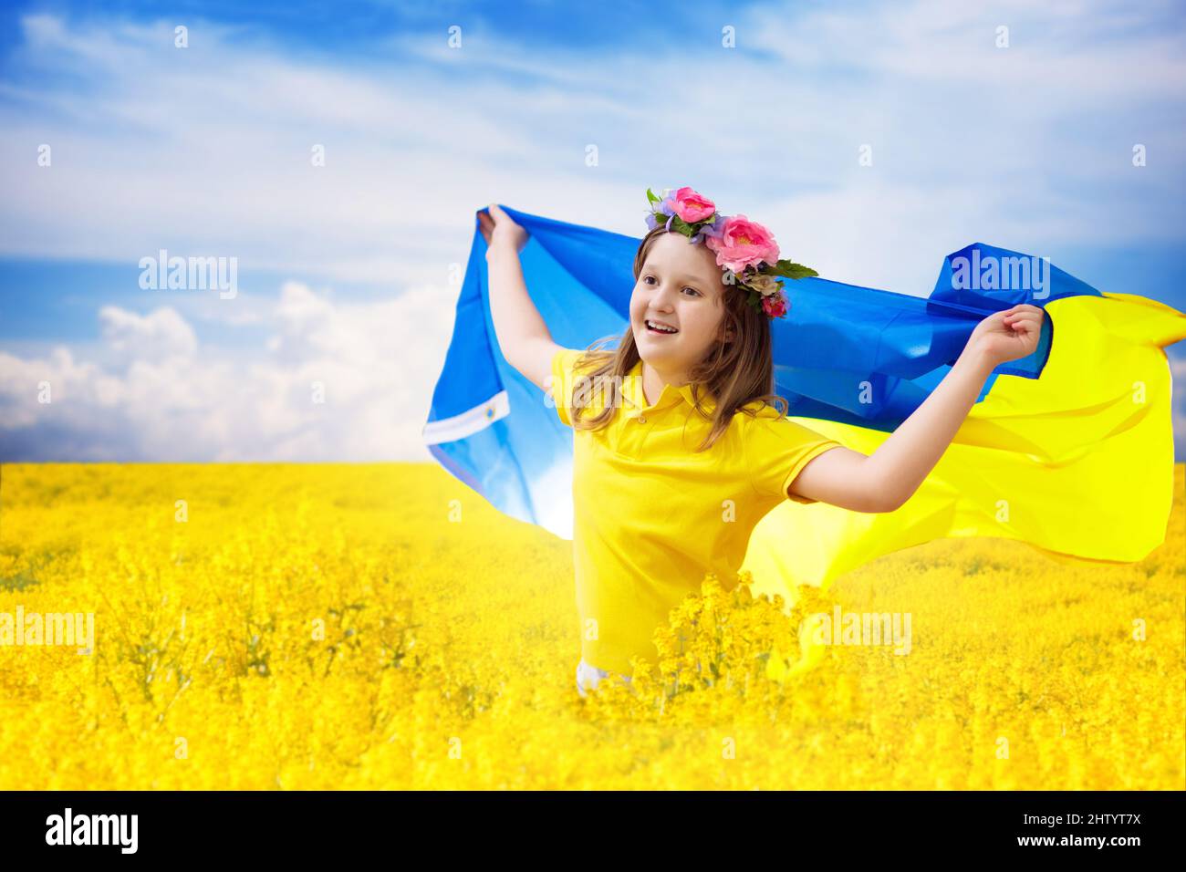 Pray for Ukraine. Child with Ukrainian flag. Little girl waving ...