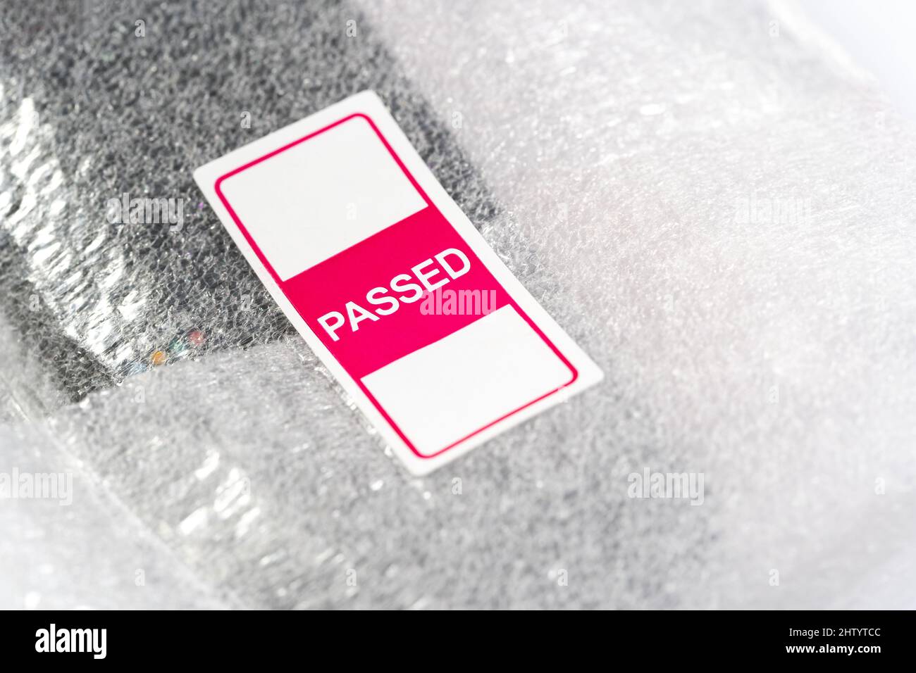 Product quality control process inspection passed sticker, packaging ...