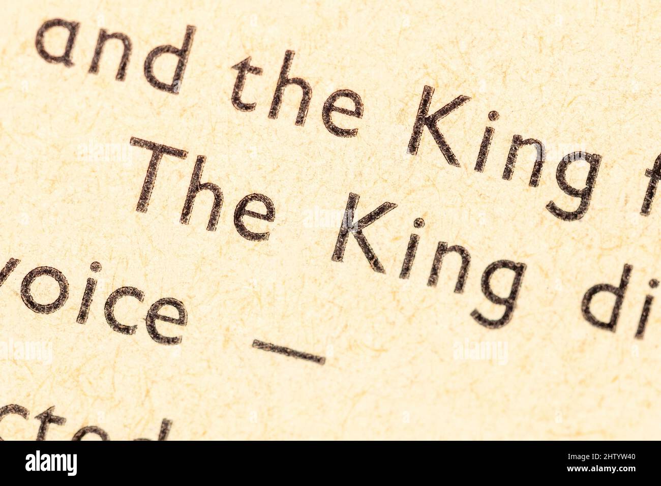 The King, printed word, text in an old antique book, macro, extreme ...