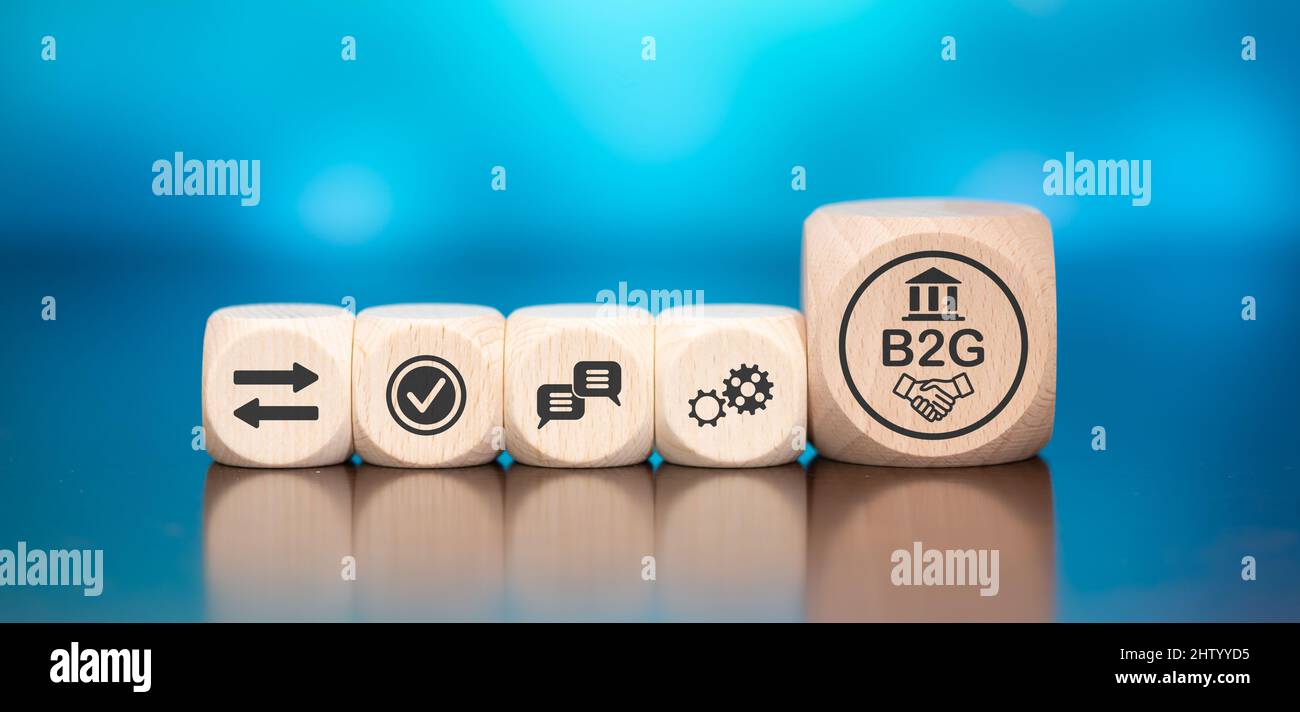 Wooden blocks with symbol of b2g concept on blue background Stock Photo ...