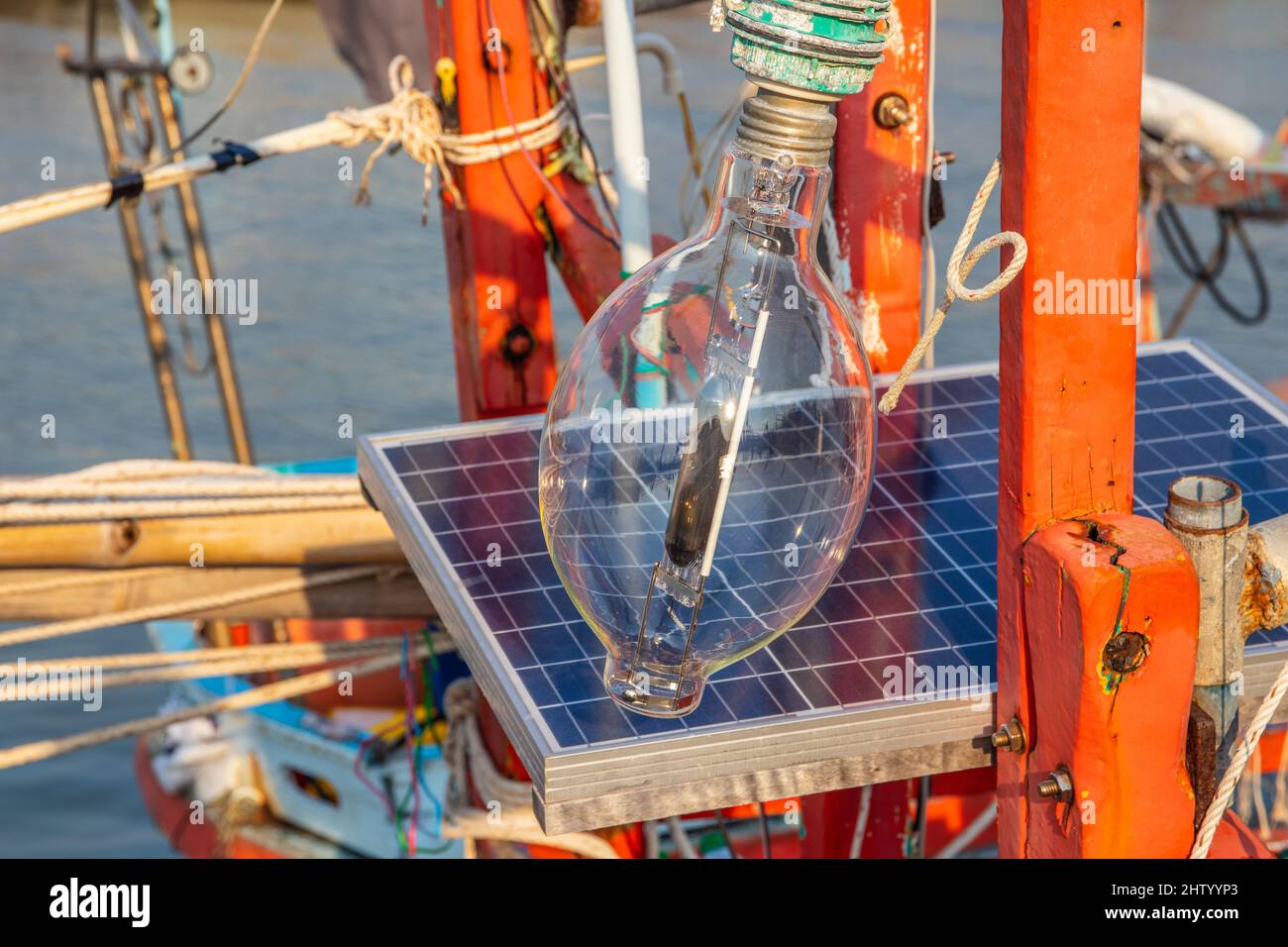 A halogen lamp with a solar battery charging station on the deck of a ...