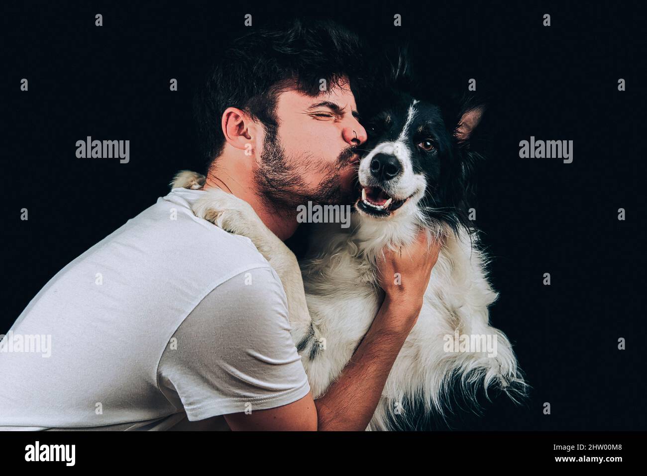 man kissing his dog with love Stock Photo - Alamy