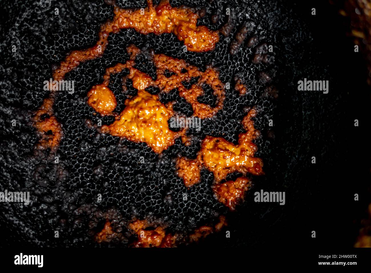 Deep dark abstract yellow-orange burning cream texture. Milk burning ...