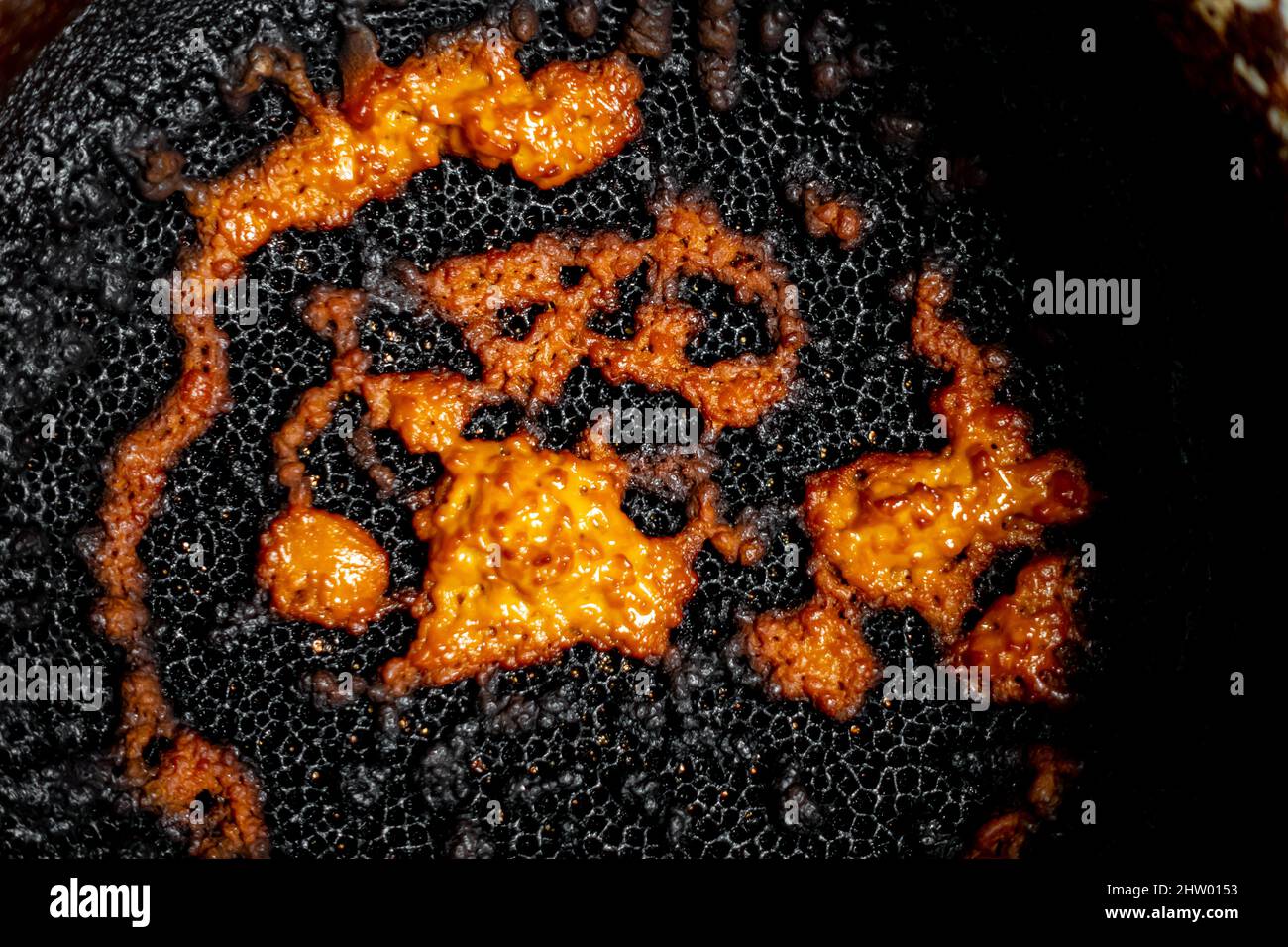 Deep dark abstract yellow-orange burning cream texture. Milk burning ...