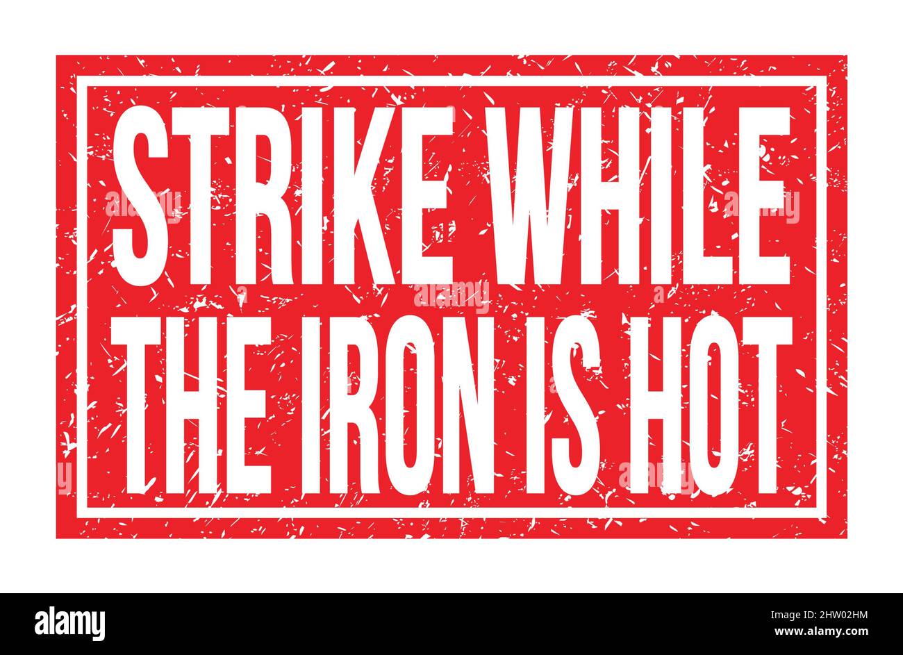 STRIKE WHILE THE IRON IS HOT, words written on red rectangle stamp sign ...