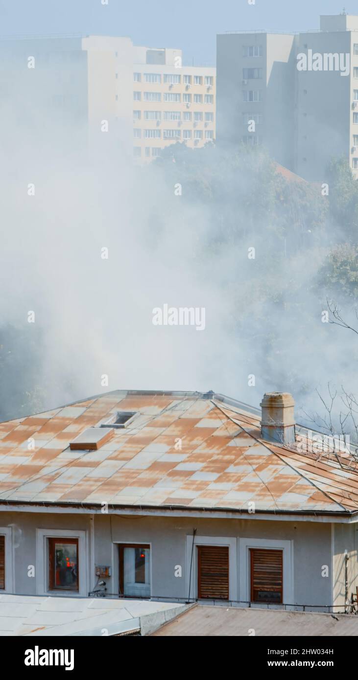 Close up of firefighters on platform truck helping with fire from ...