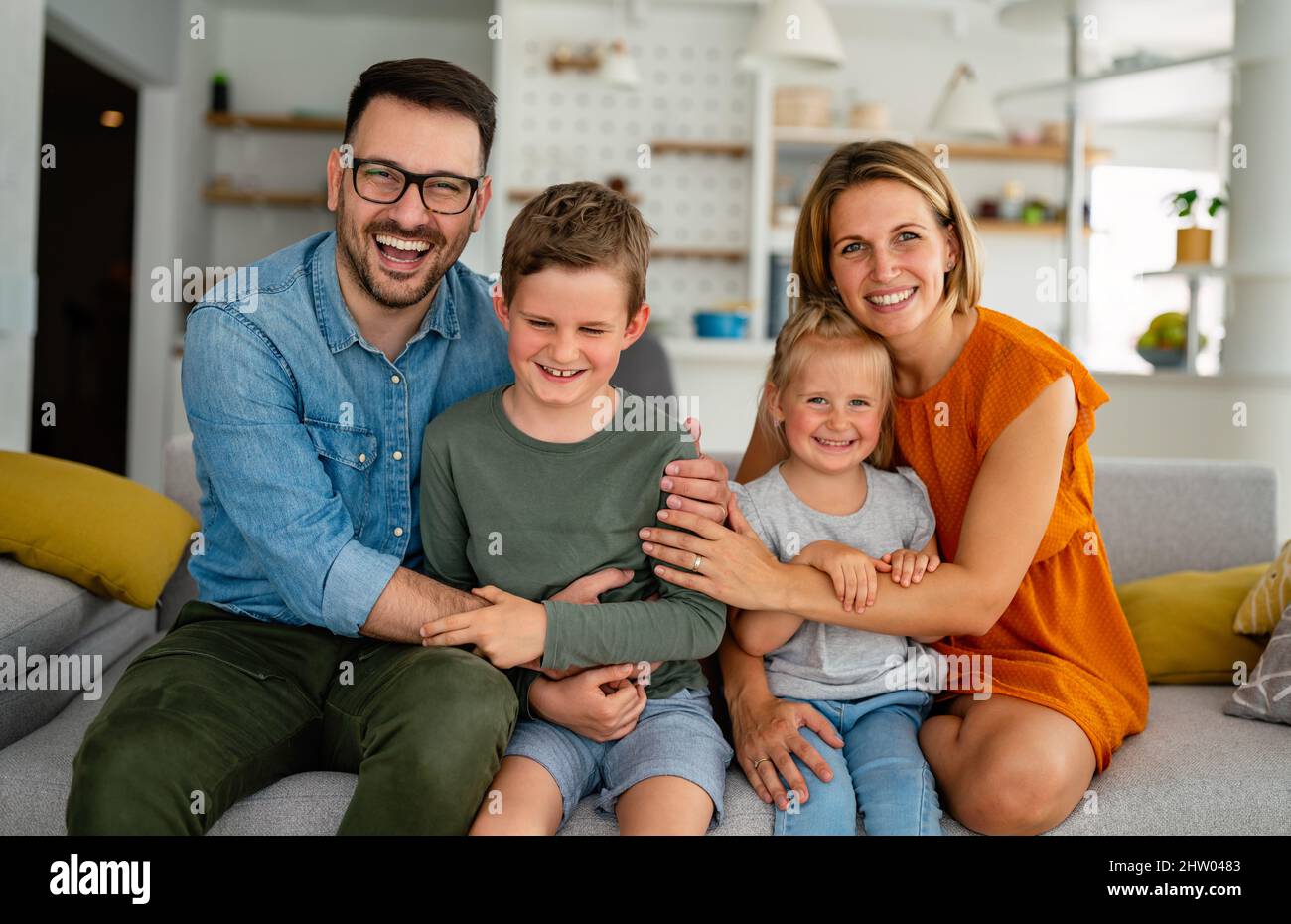 Happy family having fun time at home. Parents children love happiness ...