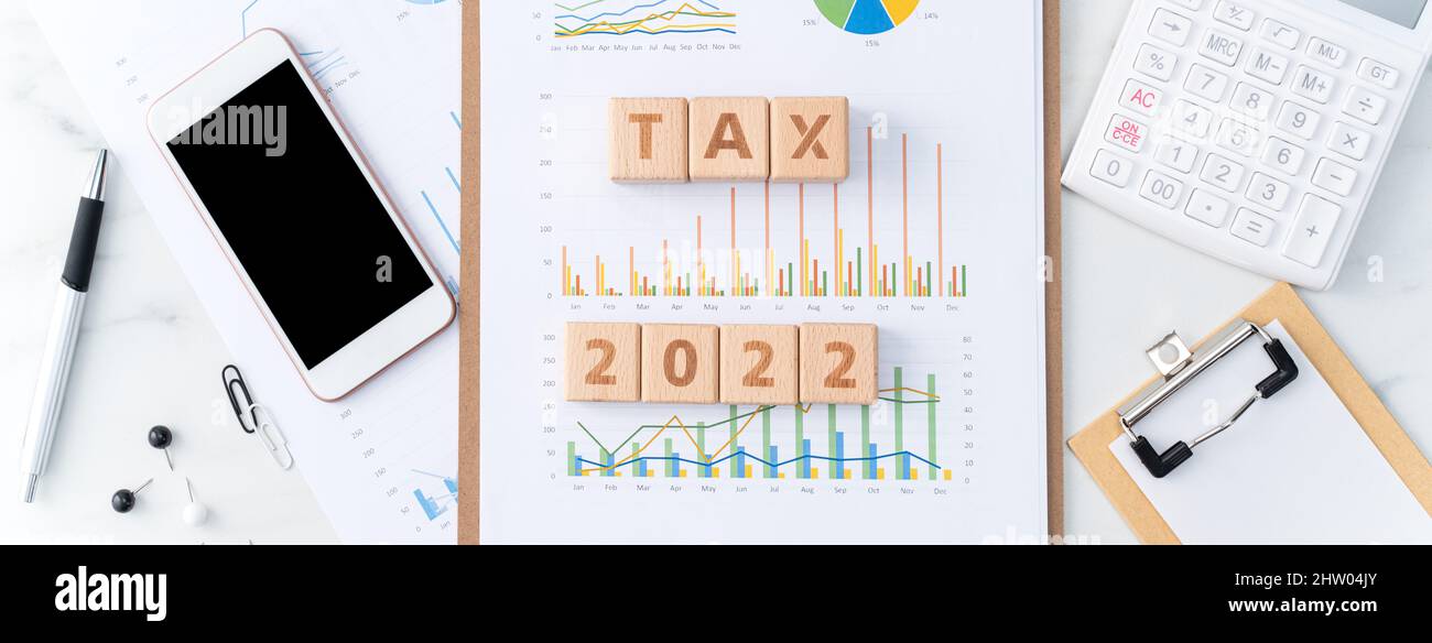 Top view of reading the overview and calculating, paying tax with smart ...