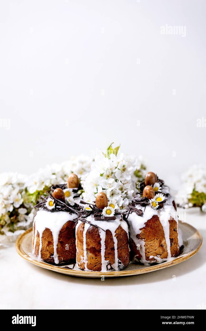 Homemade traditionla Easter kulich cake with chocolate nests and eggs ...