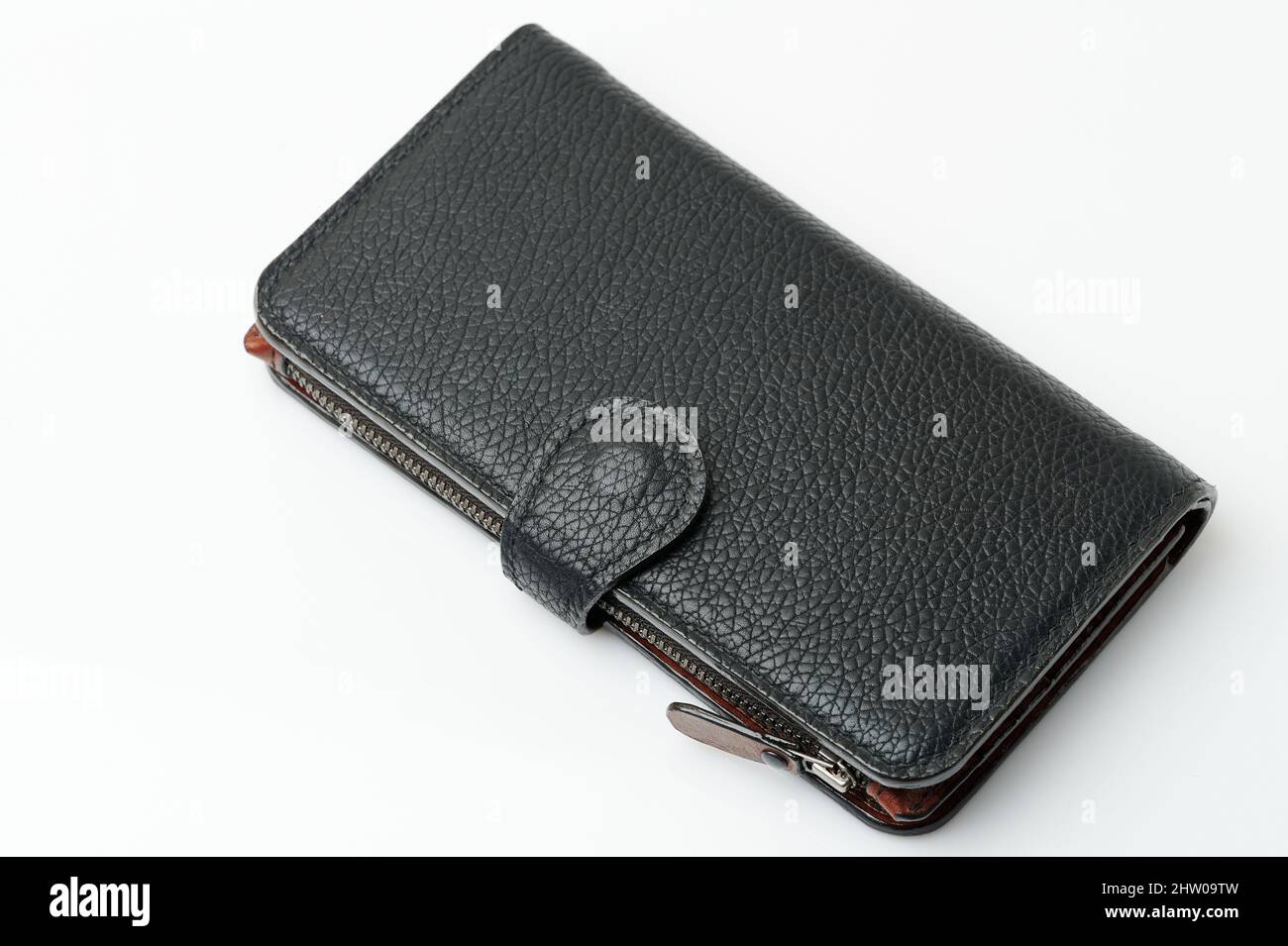 Handmade black leather purse side view isolated on studio background ...