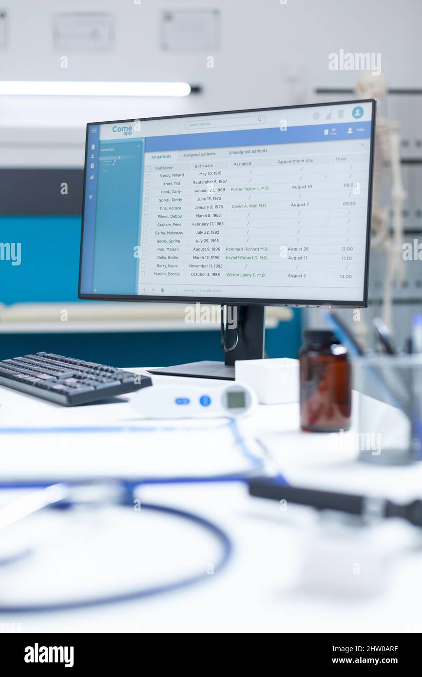 Empty doctors office having computer with patients examination files on ...