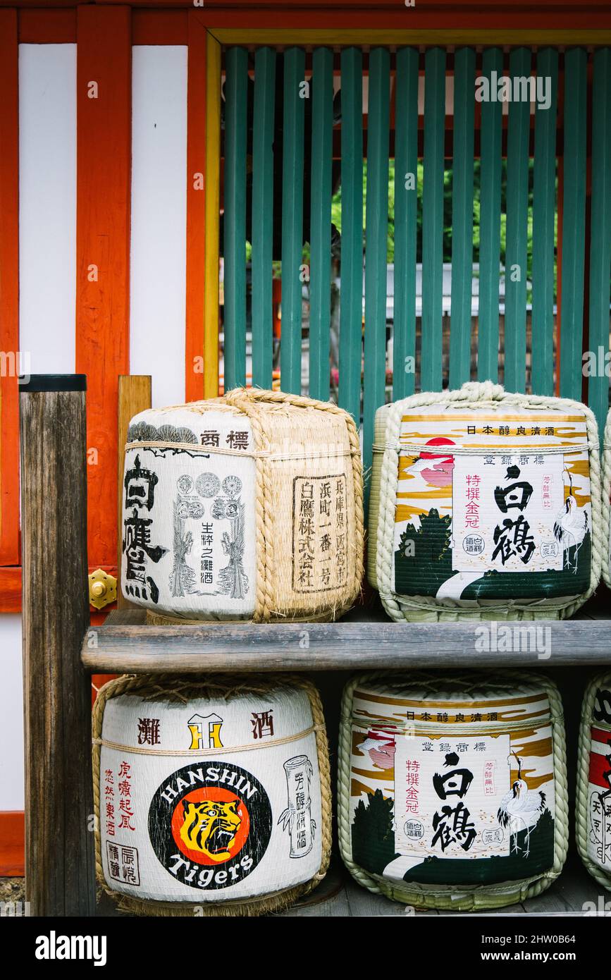 Sake barrels on shelf against building Stock Photo - Alamy