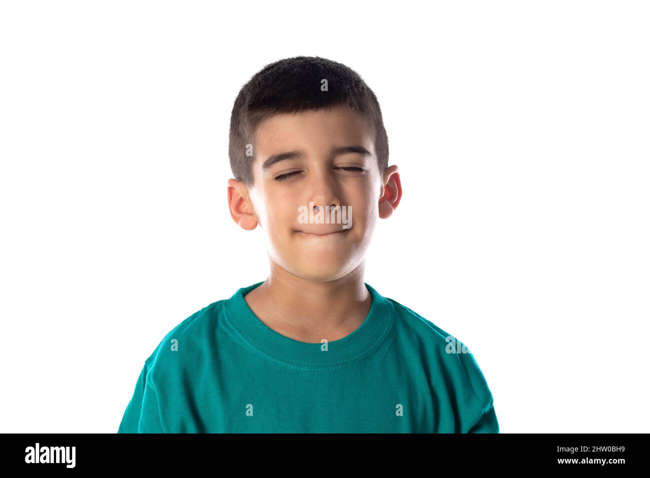 Pensive child closing his eyes and mouth dreaming about something ...