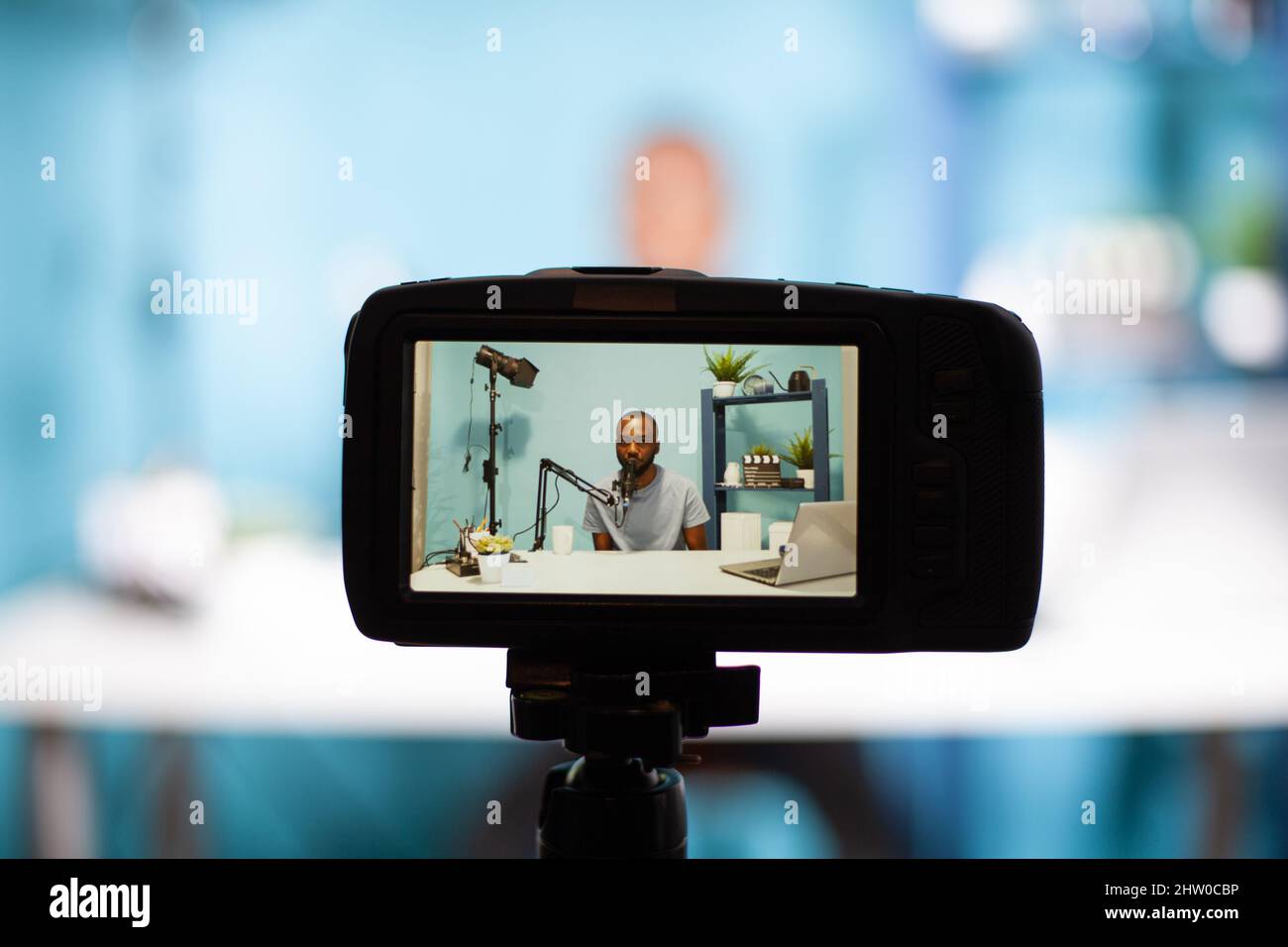 Closeup of professional digital camera on tripod recording vlogger ...