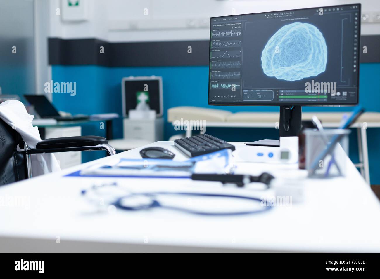 Computer standing on table having brain radiography on screen during ...