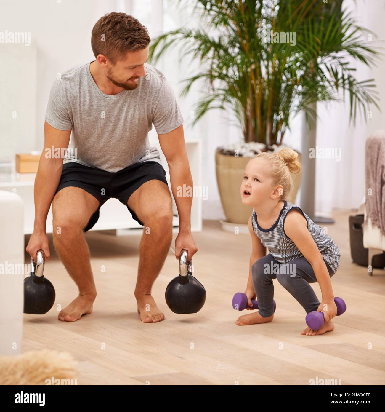 Youre getting so strong. Full length shot of a father and daughter ...