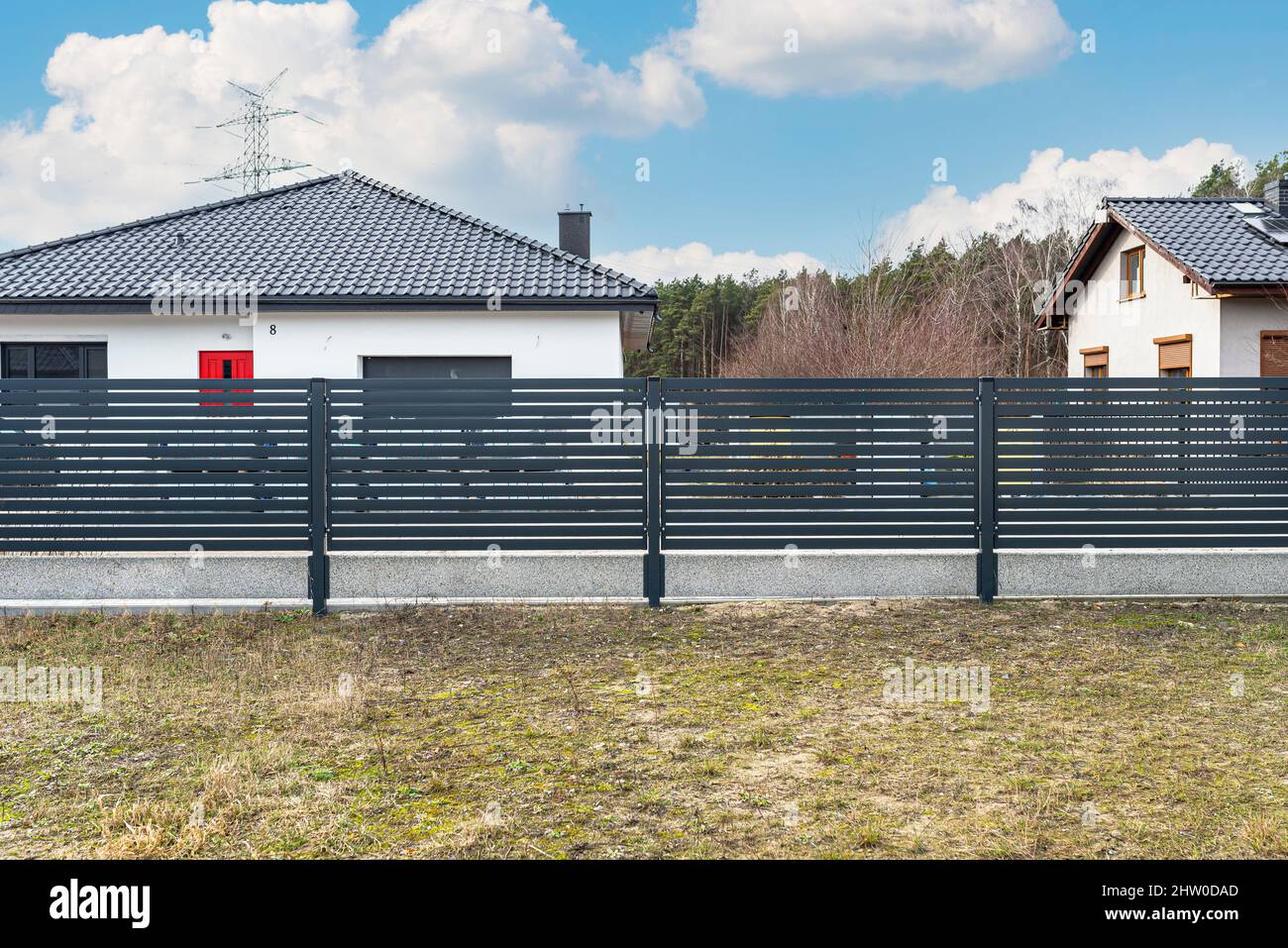 Modern anthracite panel fencing, visible spans and a fence foundation ...