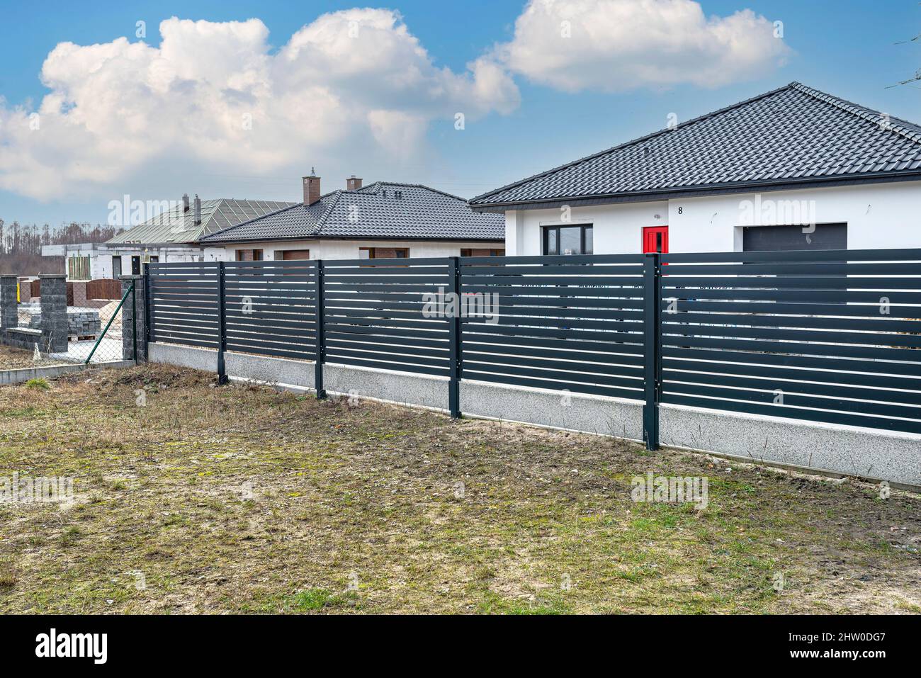 Modern anthracite panel fencing, visible spans and a fence foundation ...