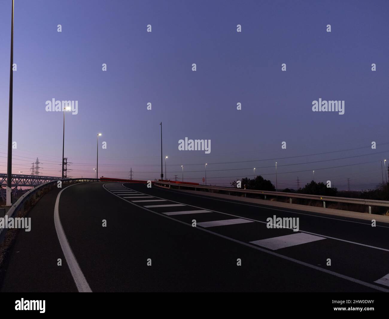 Road at night illuminated by streetlights Stock Photo - Alamy