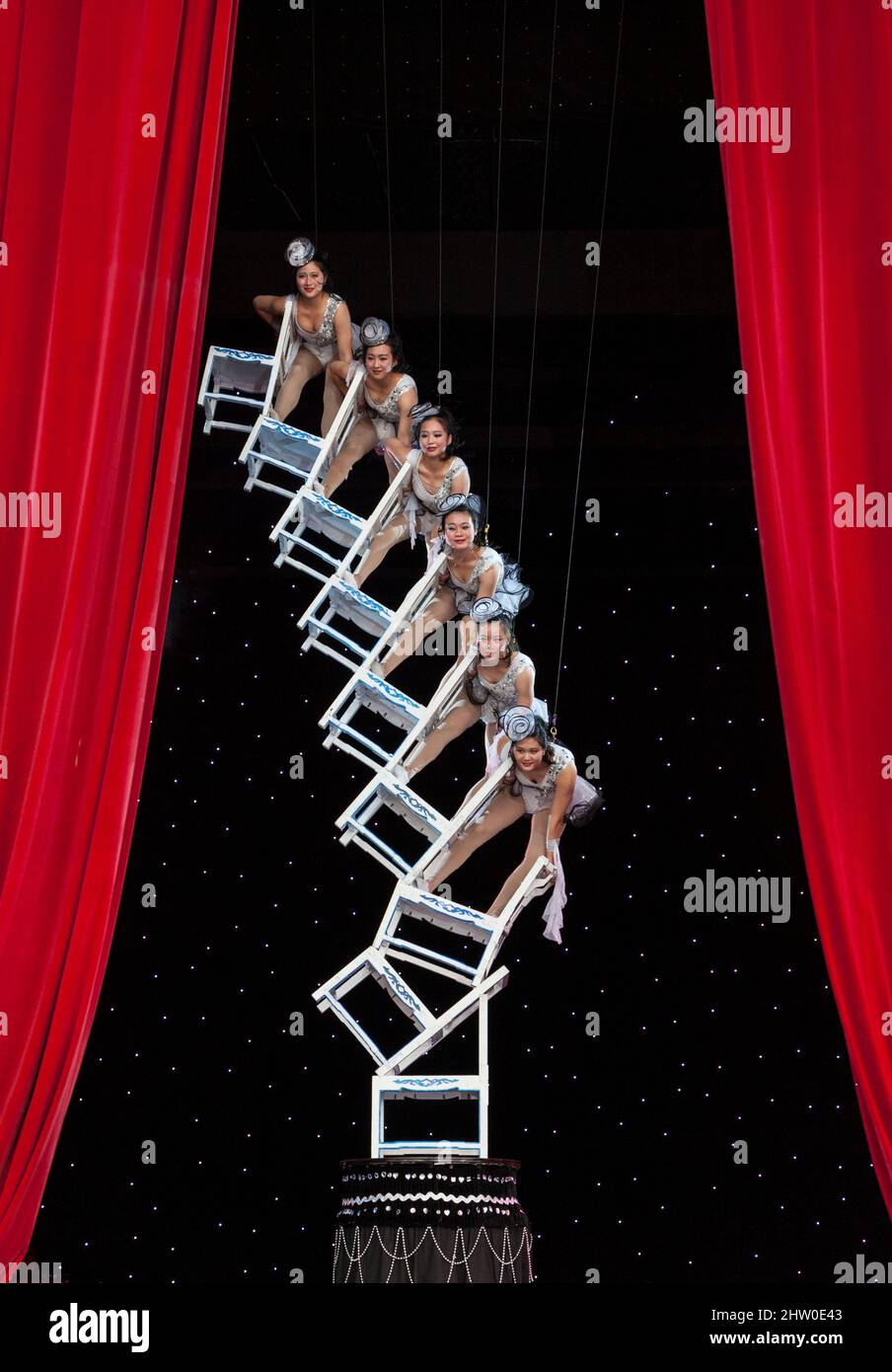 Chinese Women Acrobats Balancing on Chairs, End of Act Stock Photo - Alamy