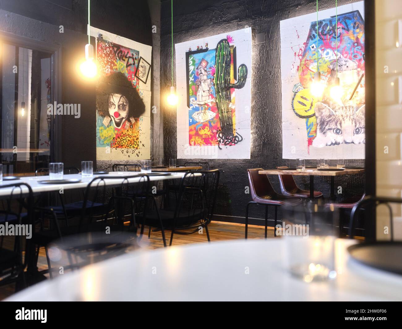 Room of a restaurant decorated with modern art paintings Stock Photo ...