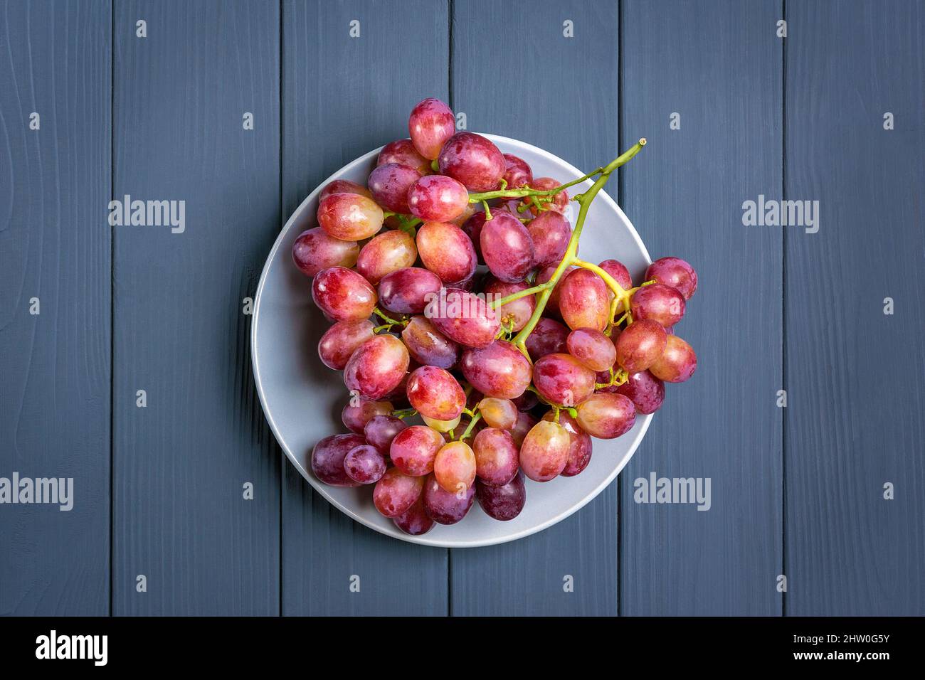Natural organic black juicy grapes on woden background Top View Flat ...