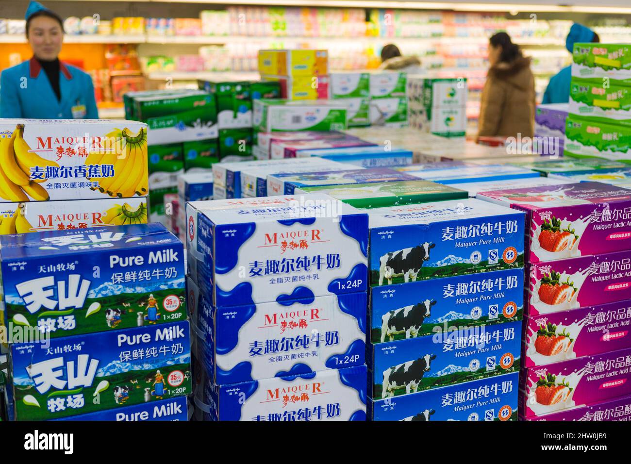 Stacked milk packages at supermarket, Urumqi, Xinjiang, China Stock ...