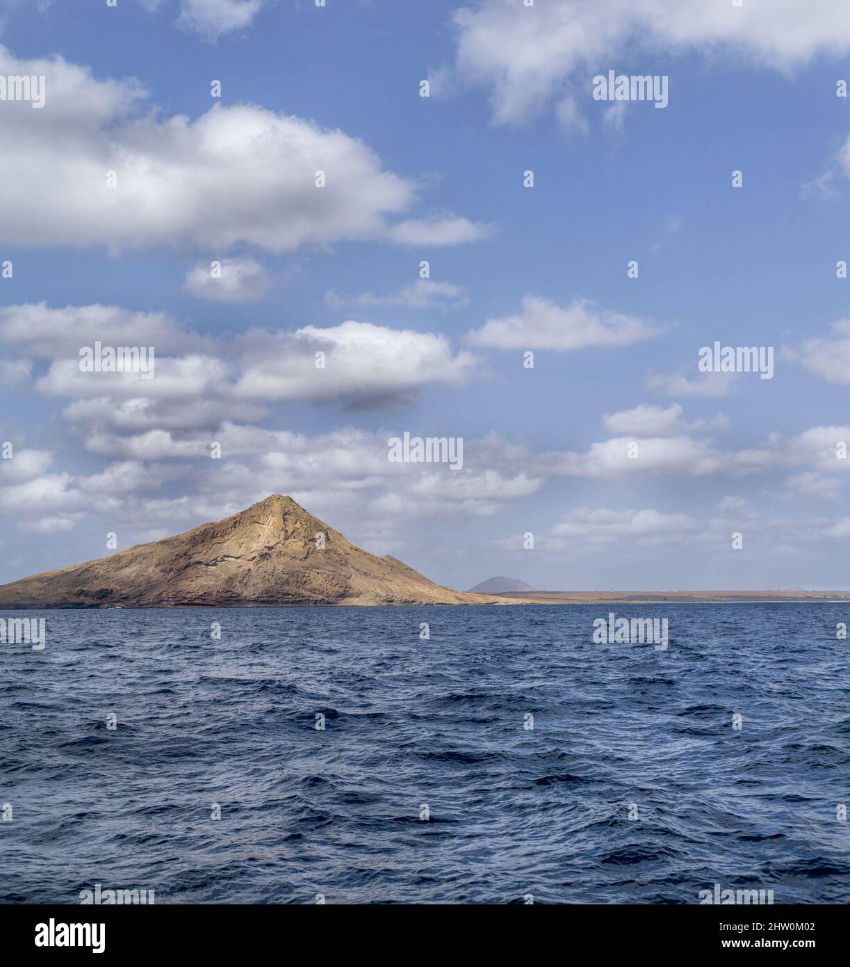 Beautiful view of the blue sea with a small hill on the shore Stock ...