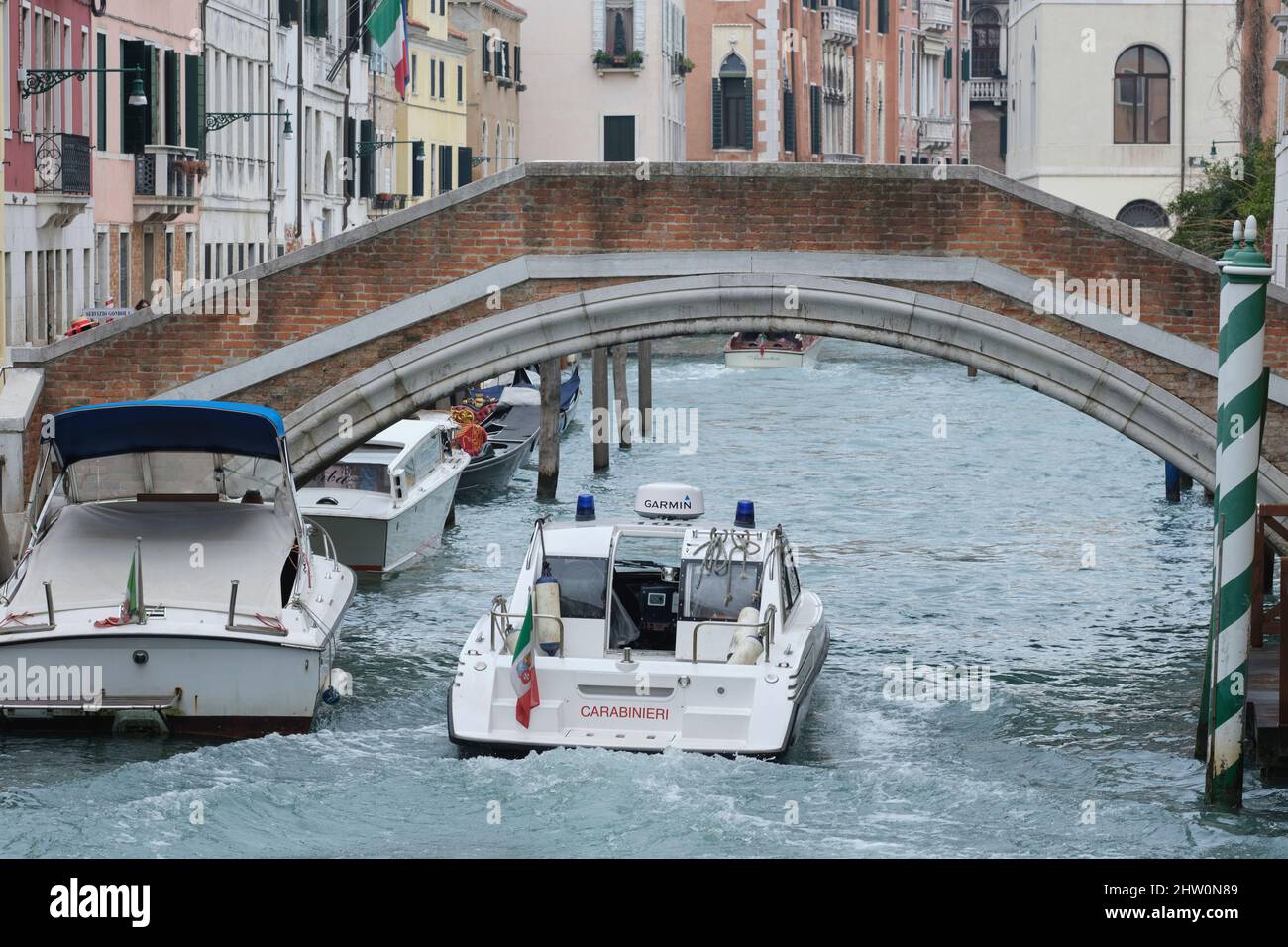 Carabinieri speedboat rushing along canal in venice Stock Photo - Alamy