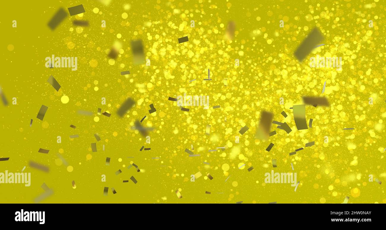 Image of golden confetti and spots falling on yellow background Stock ...
