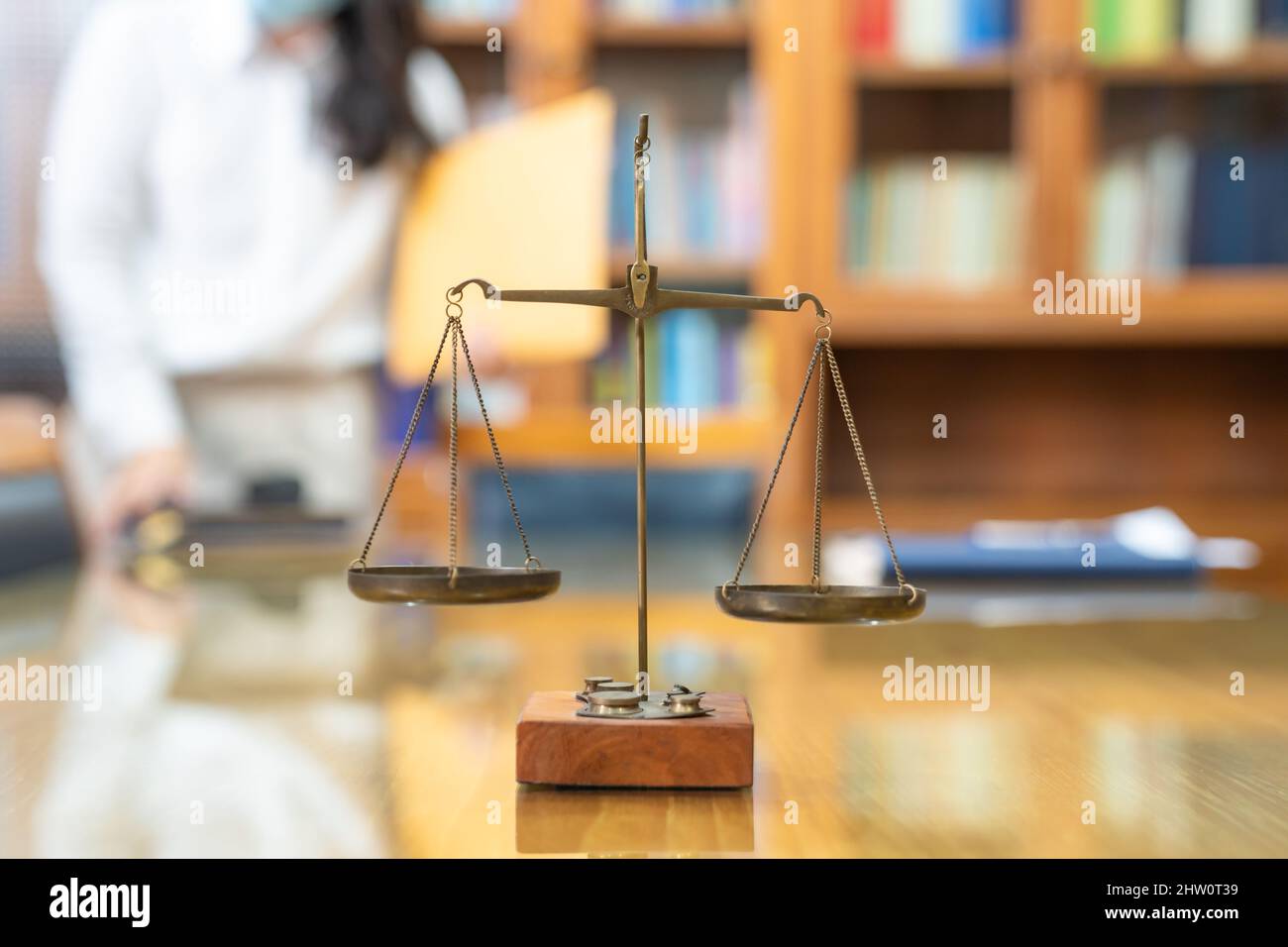 Old Brass Law Scale vintage style is laid on wood glass table in Lawyer ...