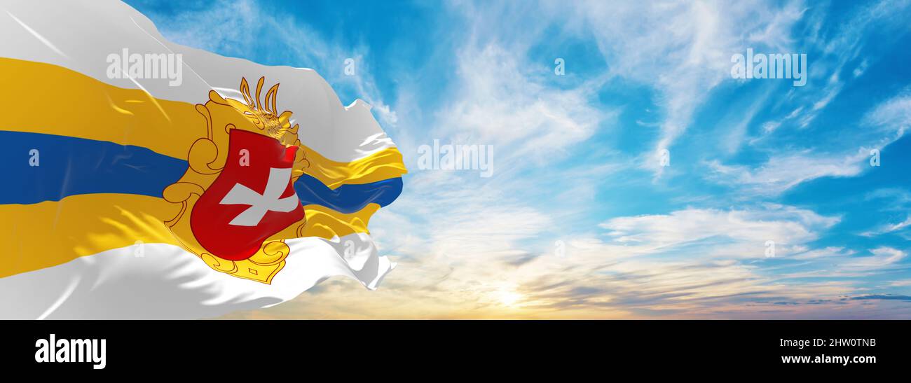 flag of Rivne region , Ukraine at cloudy sky background on sunset ...
