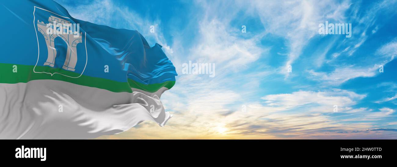 flag of Rivne , Ukraine at cloudy sky background on sunset, panoramic ...