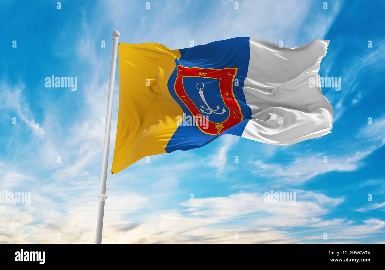 flag of Odesa region , Ukraine at cloudy sky background on sunset ...