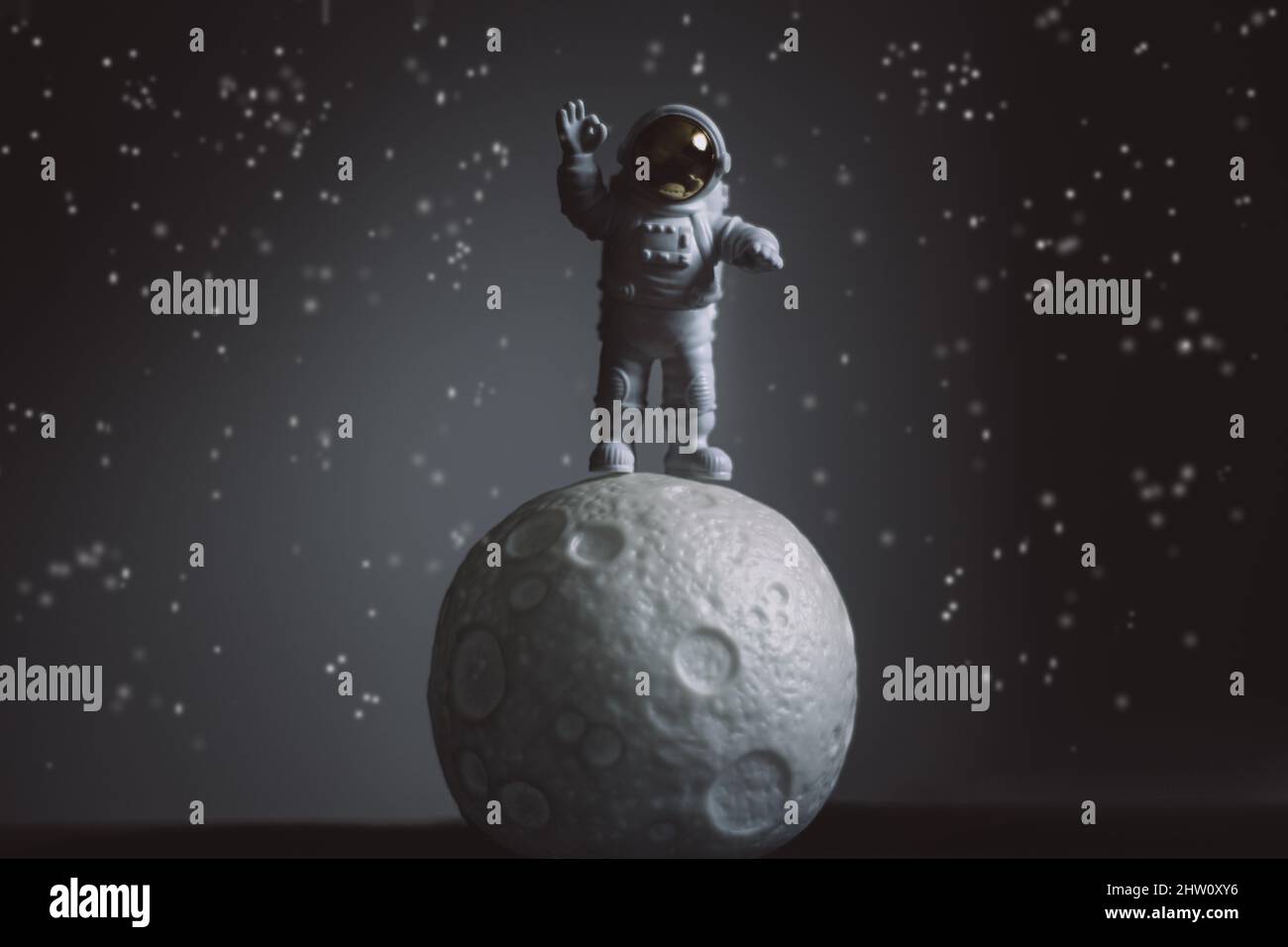 Astronaut and the Moon toys Stock Photo - Alamy