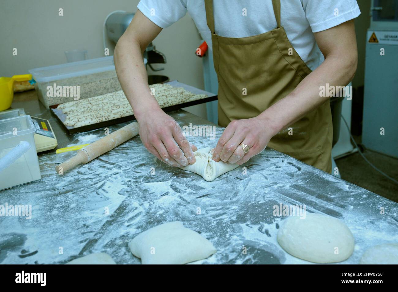 Man molding bread hi-res stock photography and images - Alamy