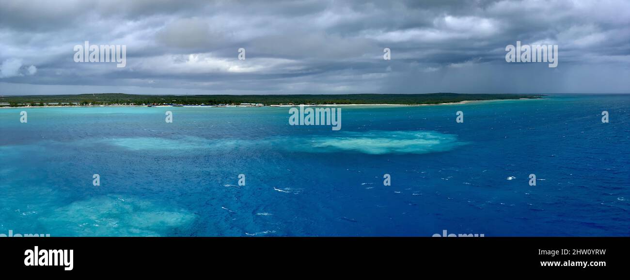 Aerial view of a green island in the beautiful azure sea under the sky ...