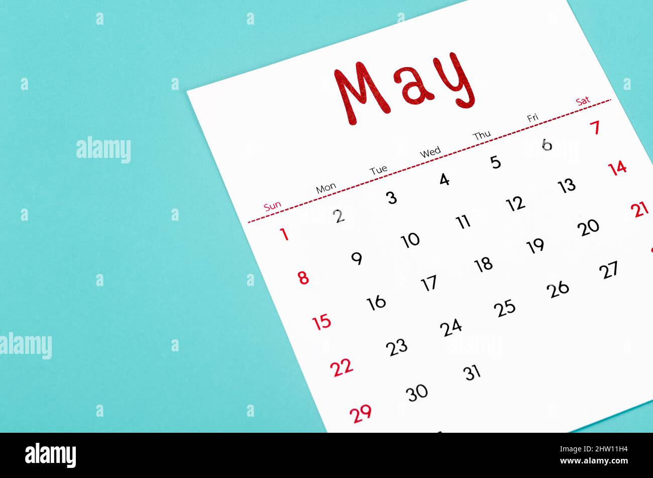 Close up May 2022 calendar sheet on light blue background Stock Photo ...